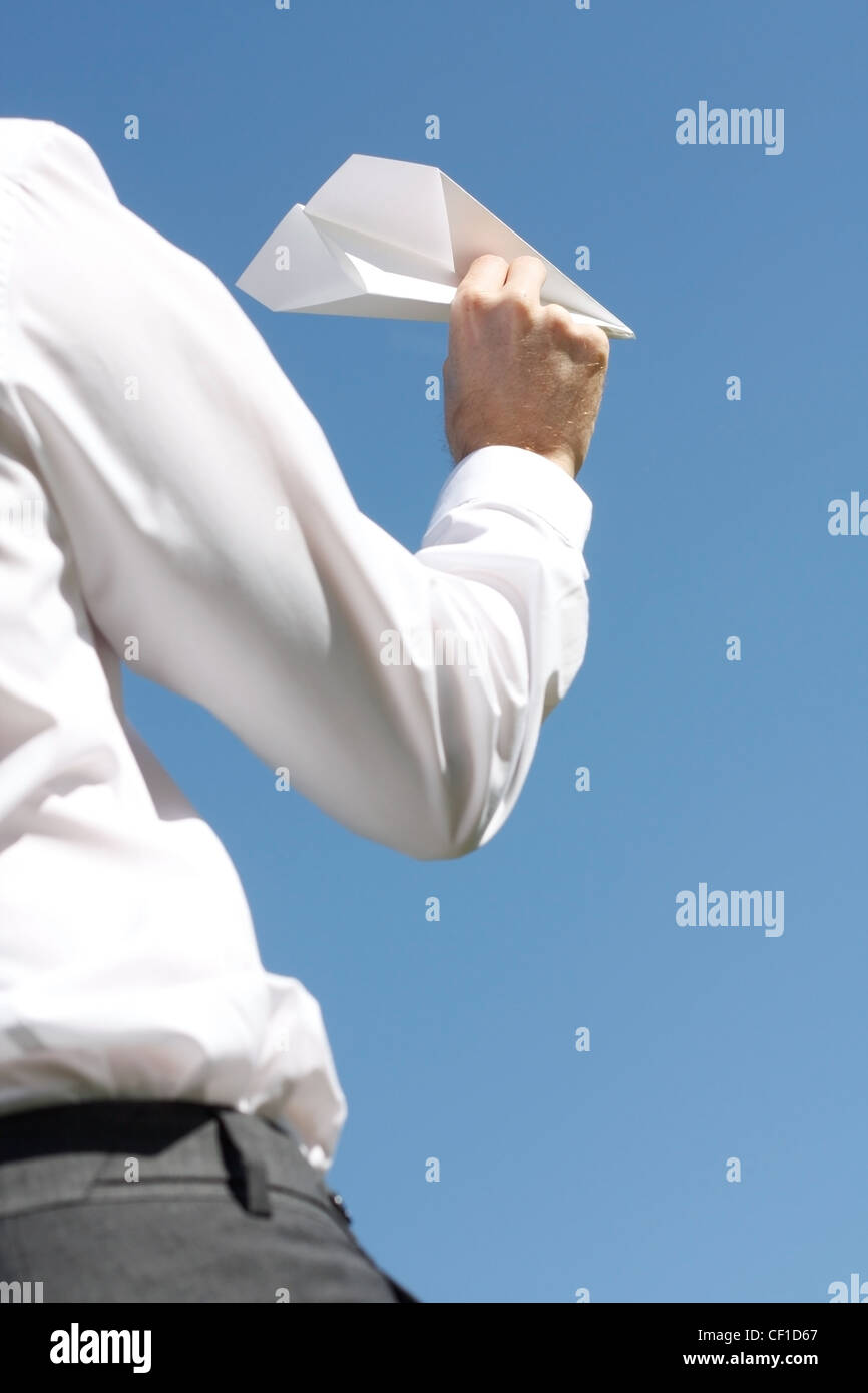 A business man throwing a paper plane Stock Photo - Alamy