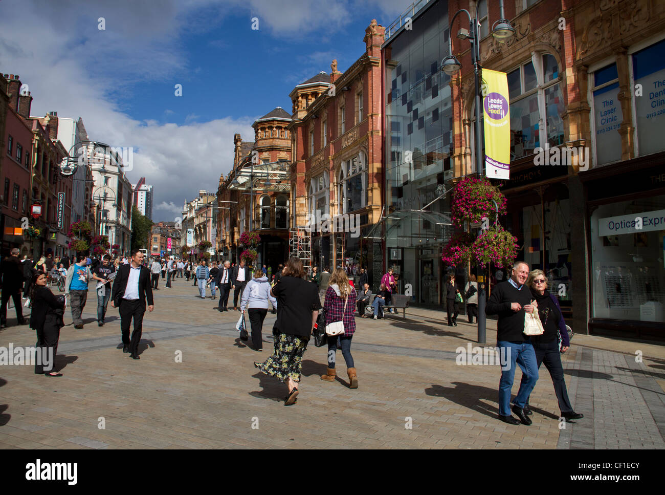 Shoppers outside Harvey Nichols, Briggate, Leeds city centre Stock ...