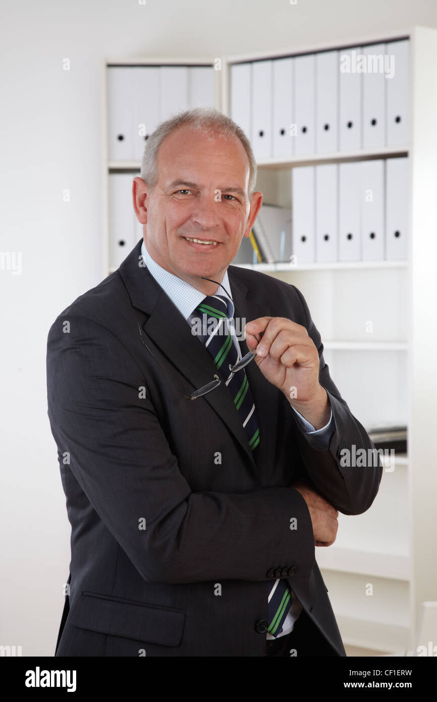 old business man with smiling in office Stock Photo - Alamy
