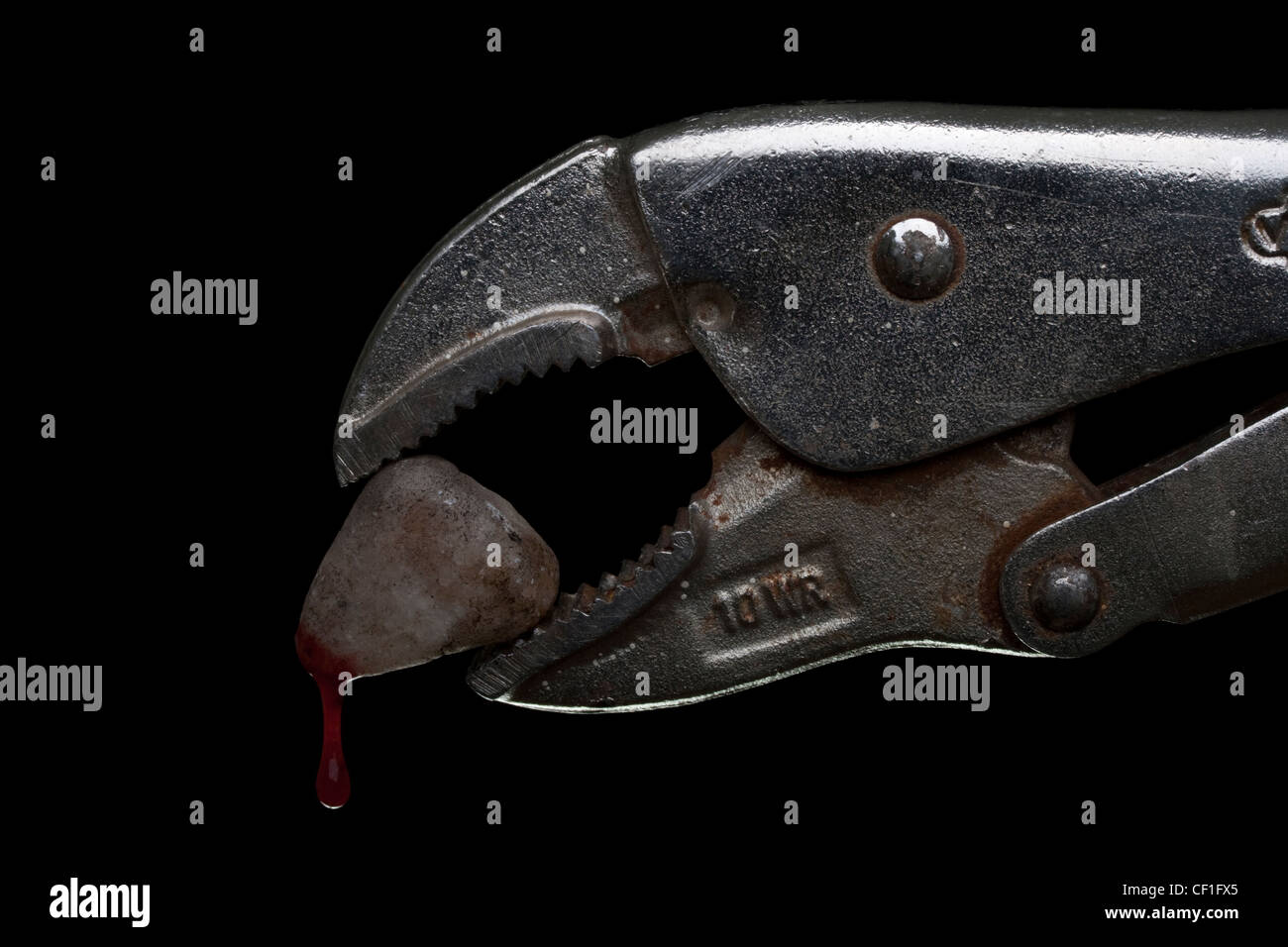 Vise grips squeeze blood from a stone Stock Photo - Alamy