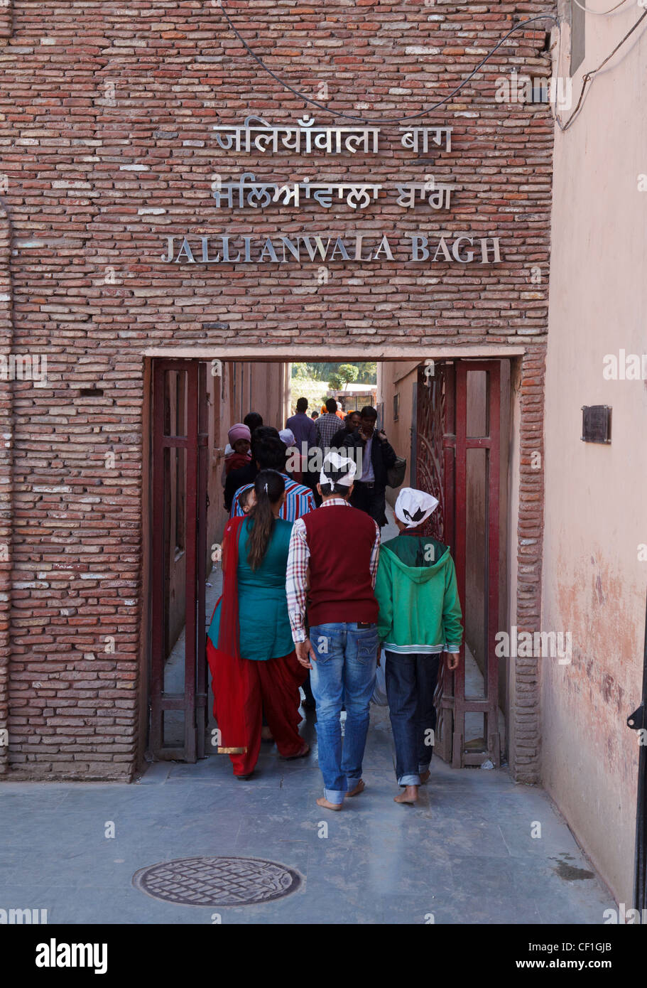 Visitors entering Jallianwala Bagh, the site of the Amritsar massacre ...