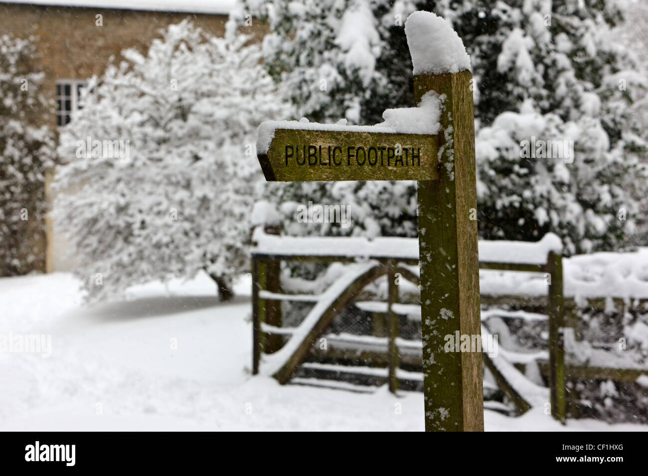 Snow on top of a Public Footpath sign in a snowy winter village Stock ...