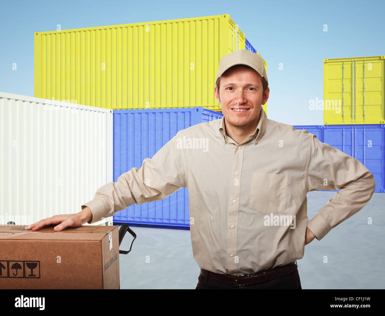 smiling manual worker and 3d container Stock Photo - Alamy