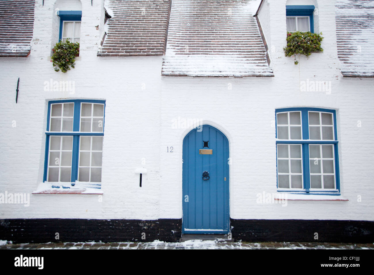 A view of the front of a traditional alms house for the poor in Bruges ...