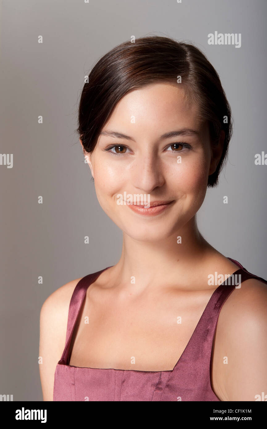 Step by Step Make Up Female with short brunette hair, wearing a mauve ...