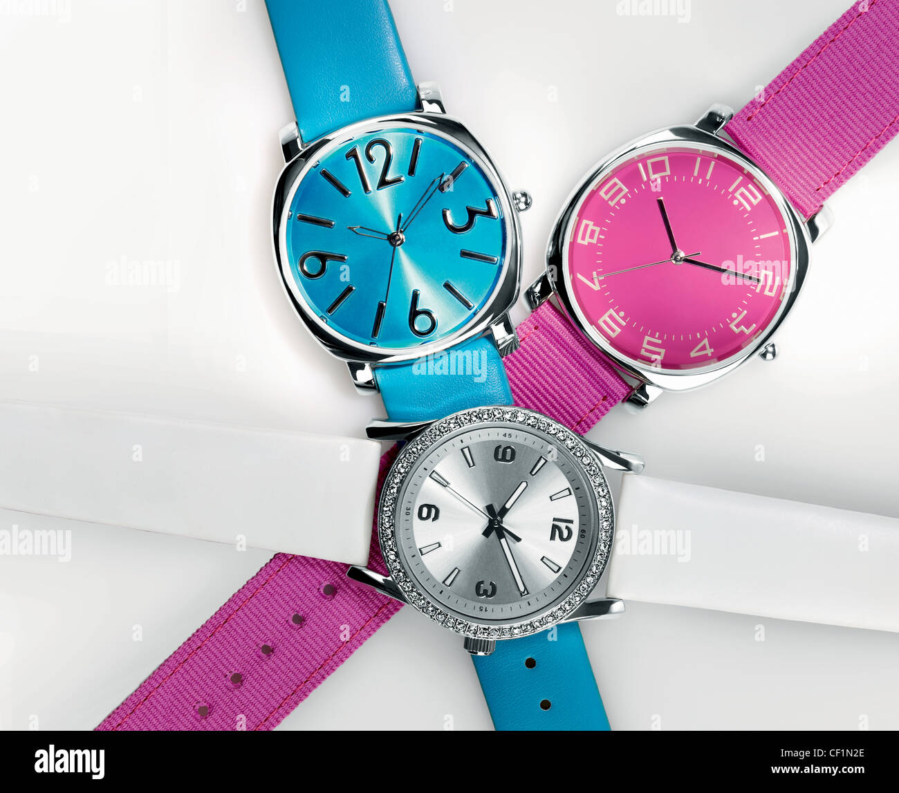 A still life shot of three funky bright watches Stock Photo - Alamy