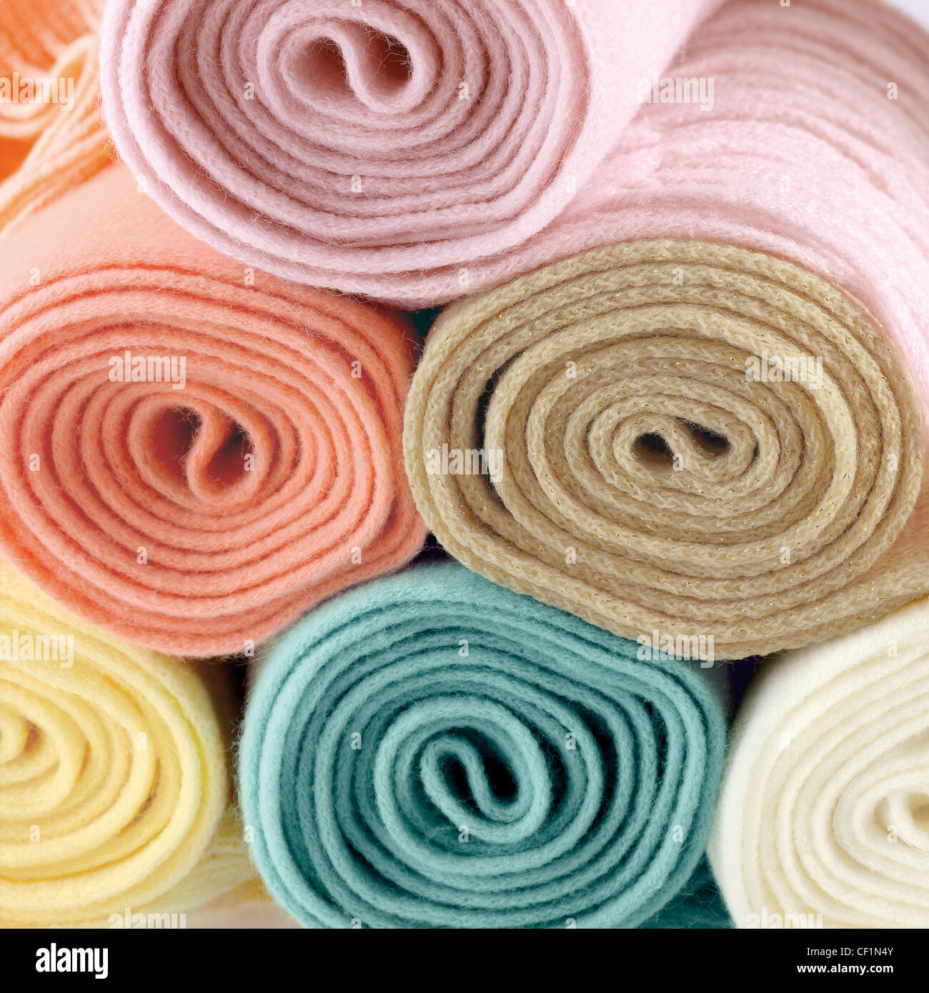 A still life shot of rolled up colourful scarves Stock Photo - Alamy