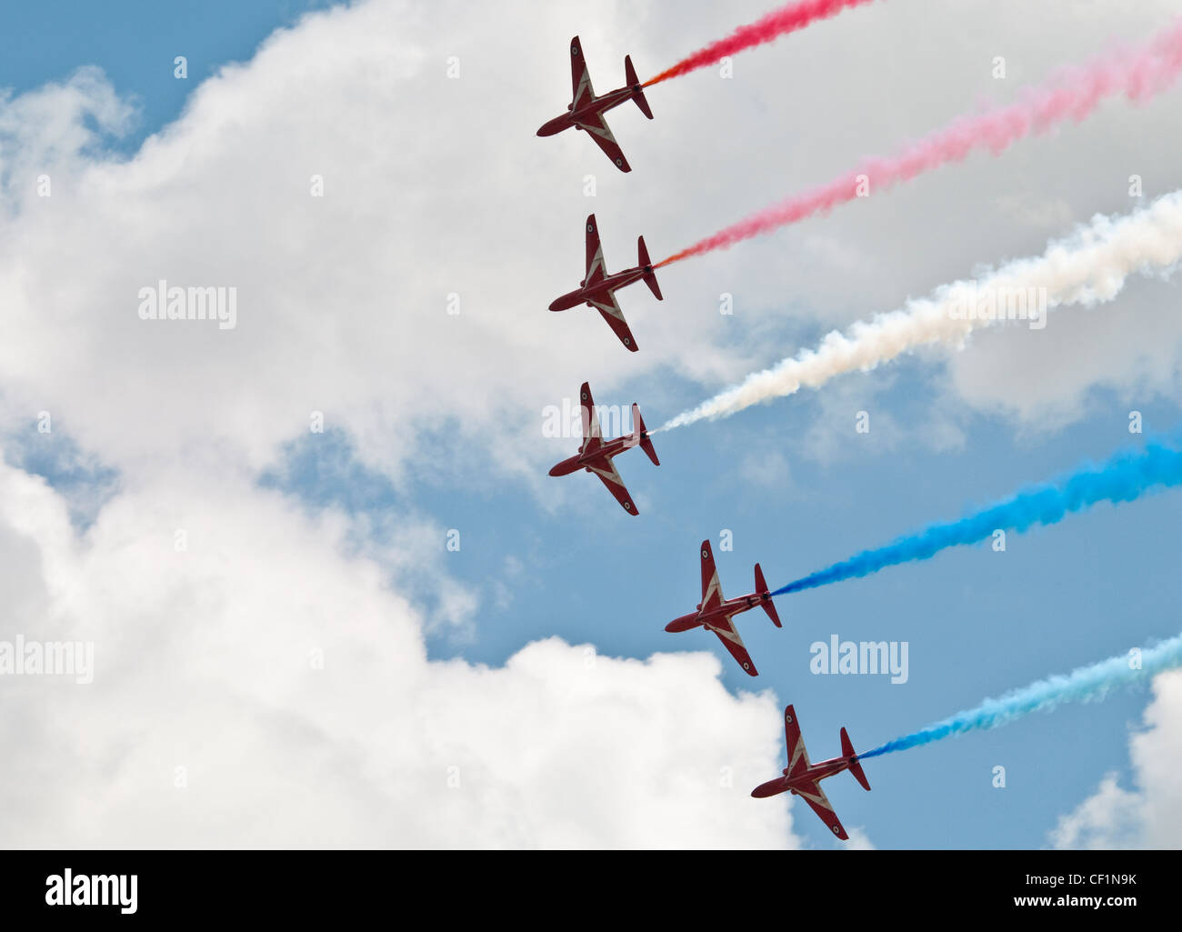 Five of the Red Arrows in formation during a flypast with red, white ...