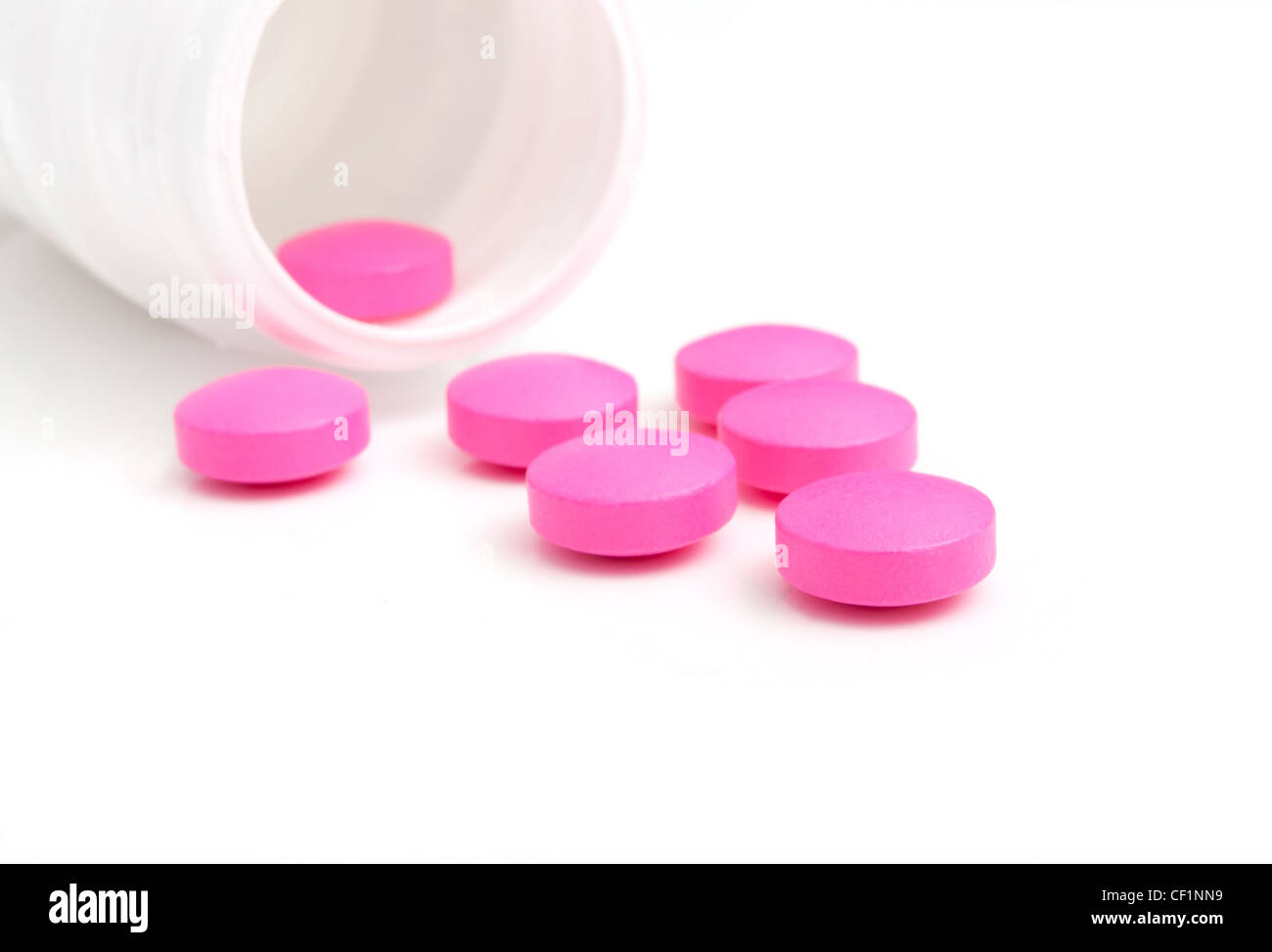 Pills bottle health tablets painkiller medicine cure pink hi-res stock ...