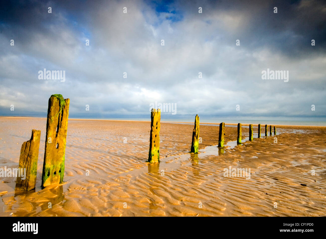 A groyne at Brancaster. A groyne is a method of coastal defence against ...