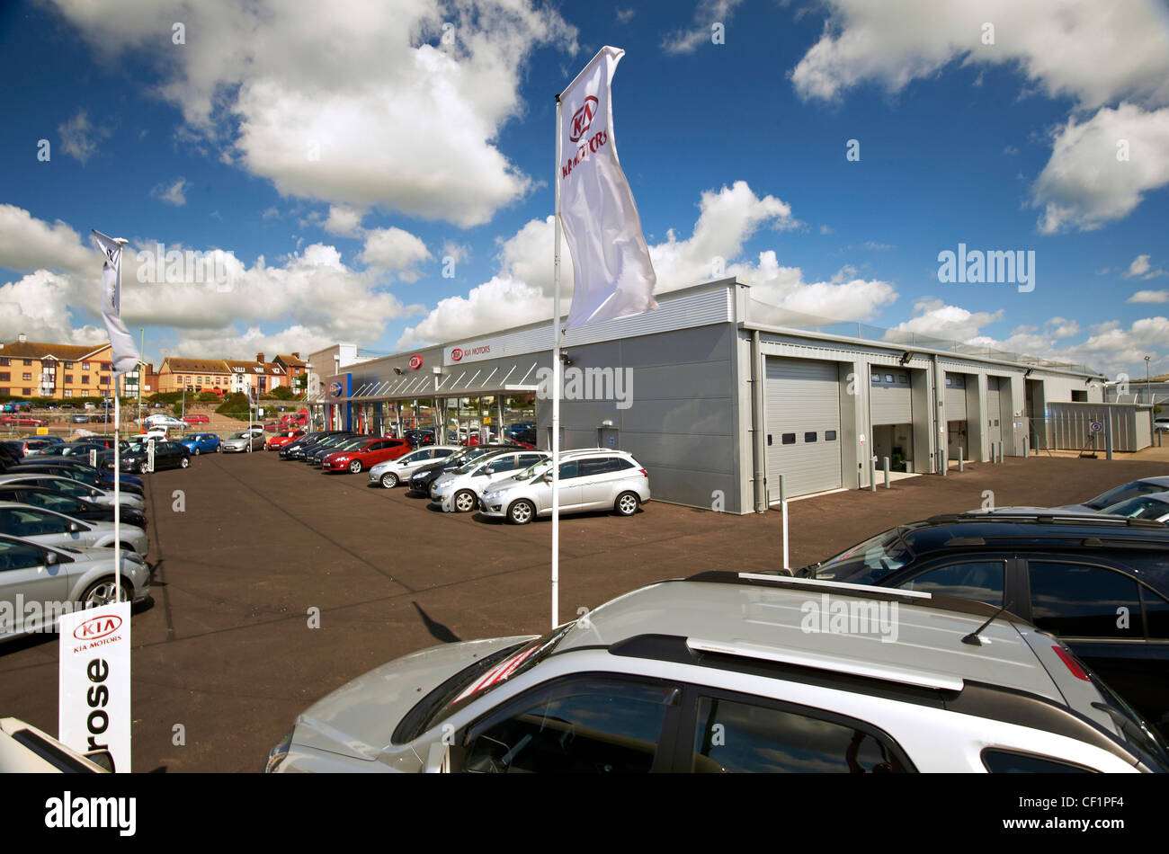The forecourt of a car showroom in the UK, showing new cars for sale ...