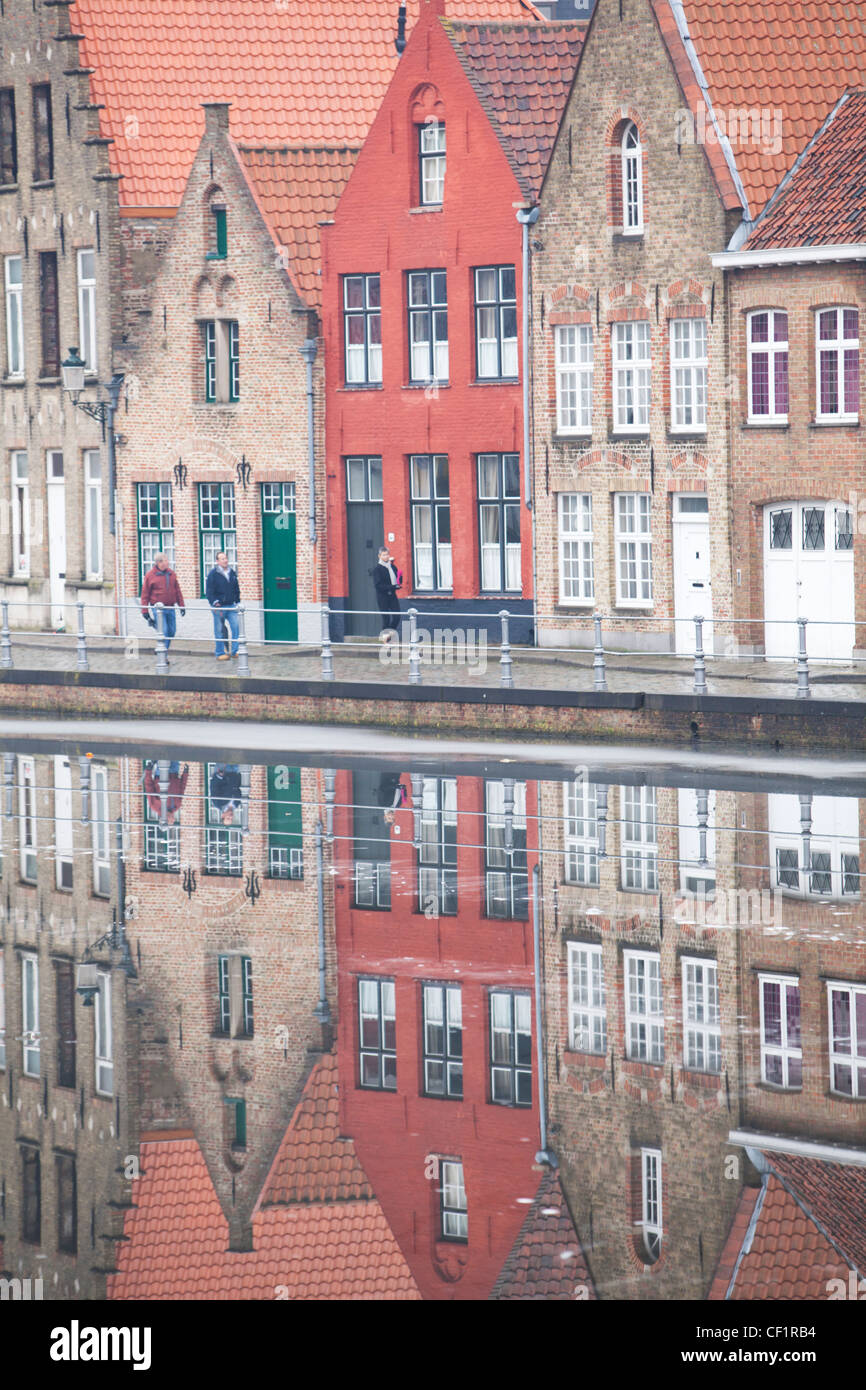 A view of a terrace of traditional houses reflected in the still waters ...