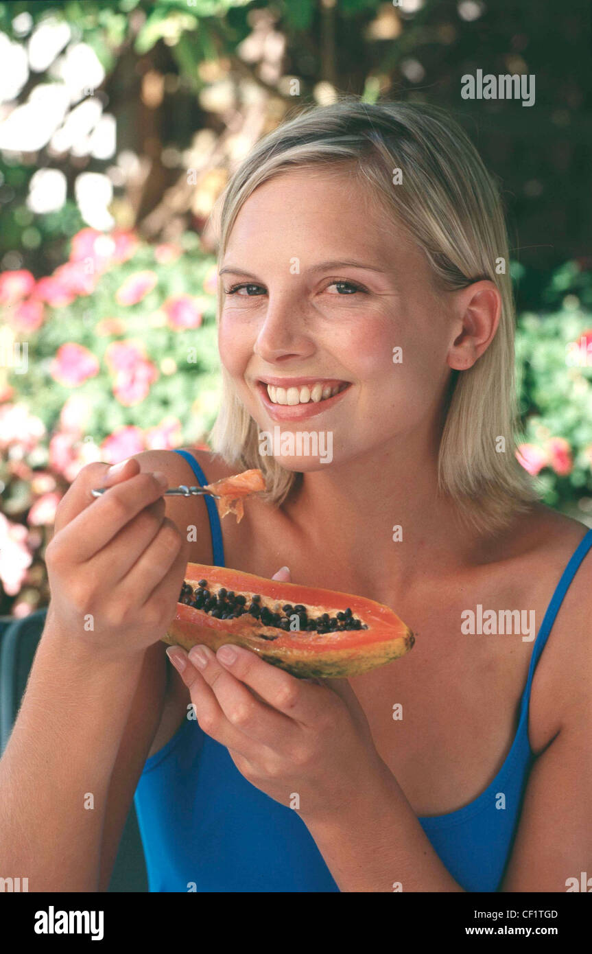 Tanned Female Chin Length Blonde Hair Wearing Subtle Make Up Blue Vest