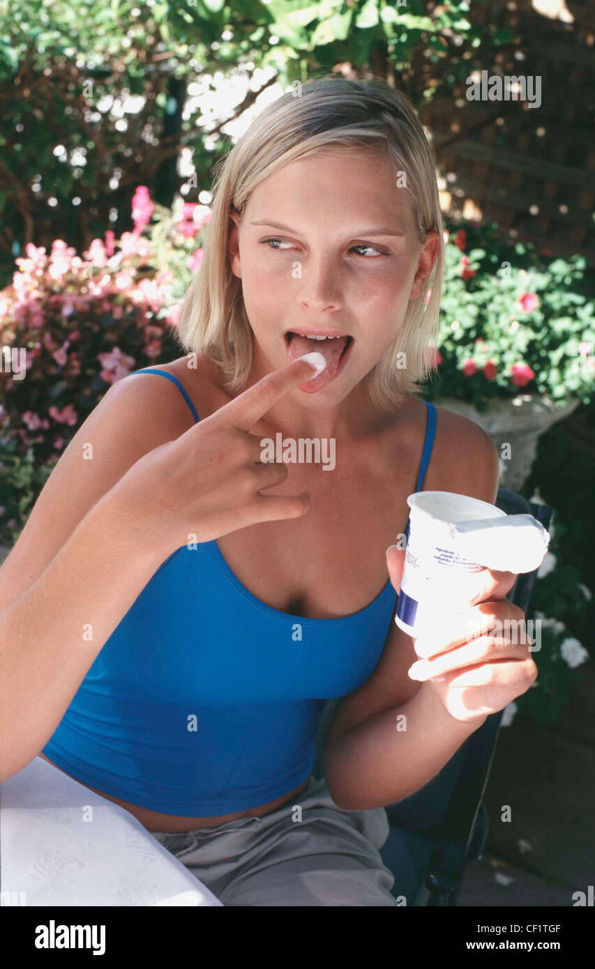 Tanned Female Chin Length Blonde Hair Wearing Subtle Make Up Blue Vest
