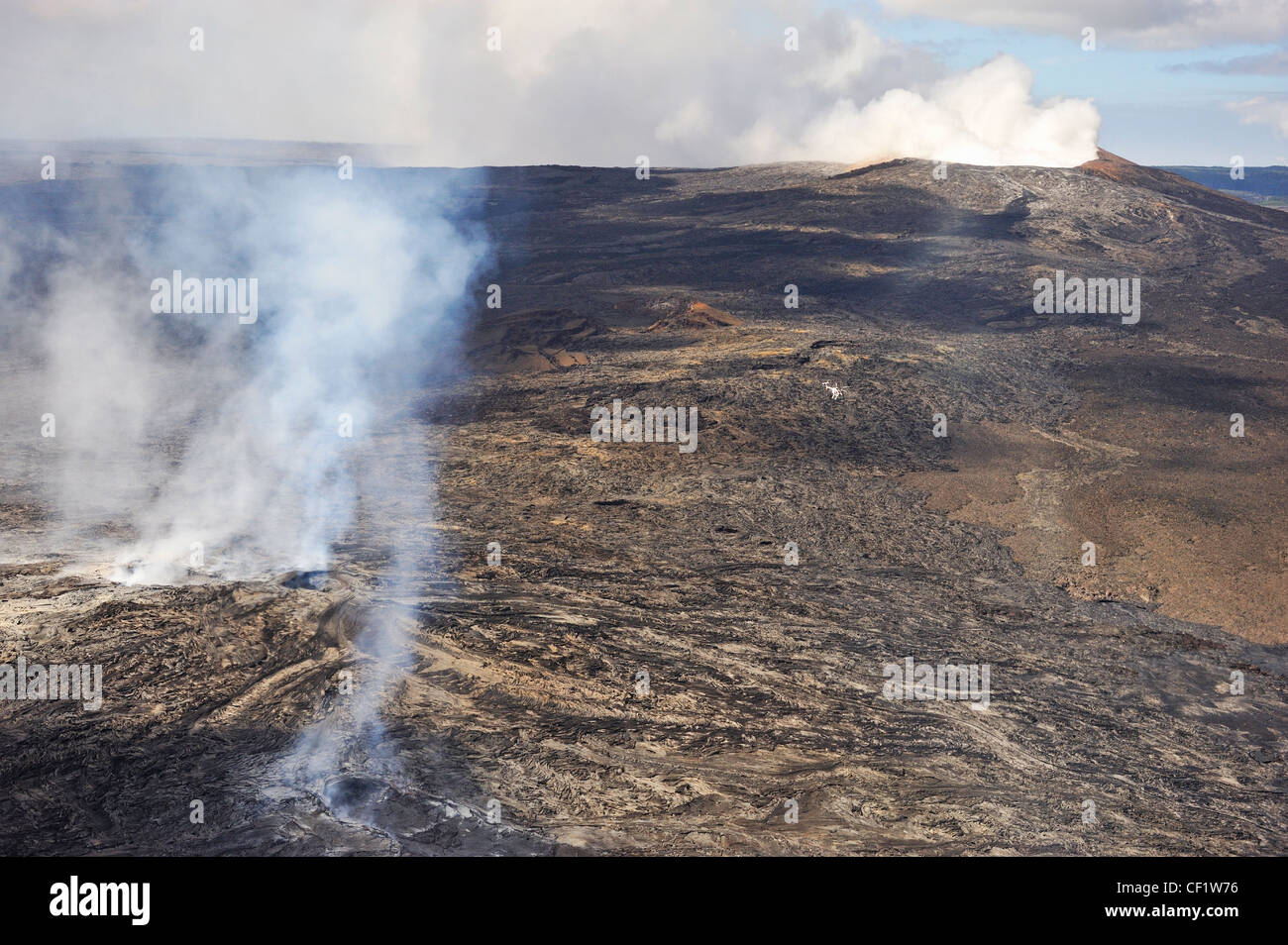 Smoking lava fields by Pu'u O'o crater, (aerial view), Kilauea Volcano ...
