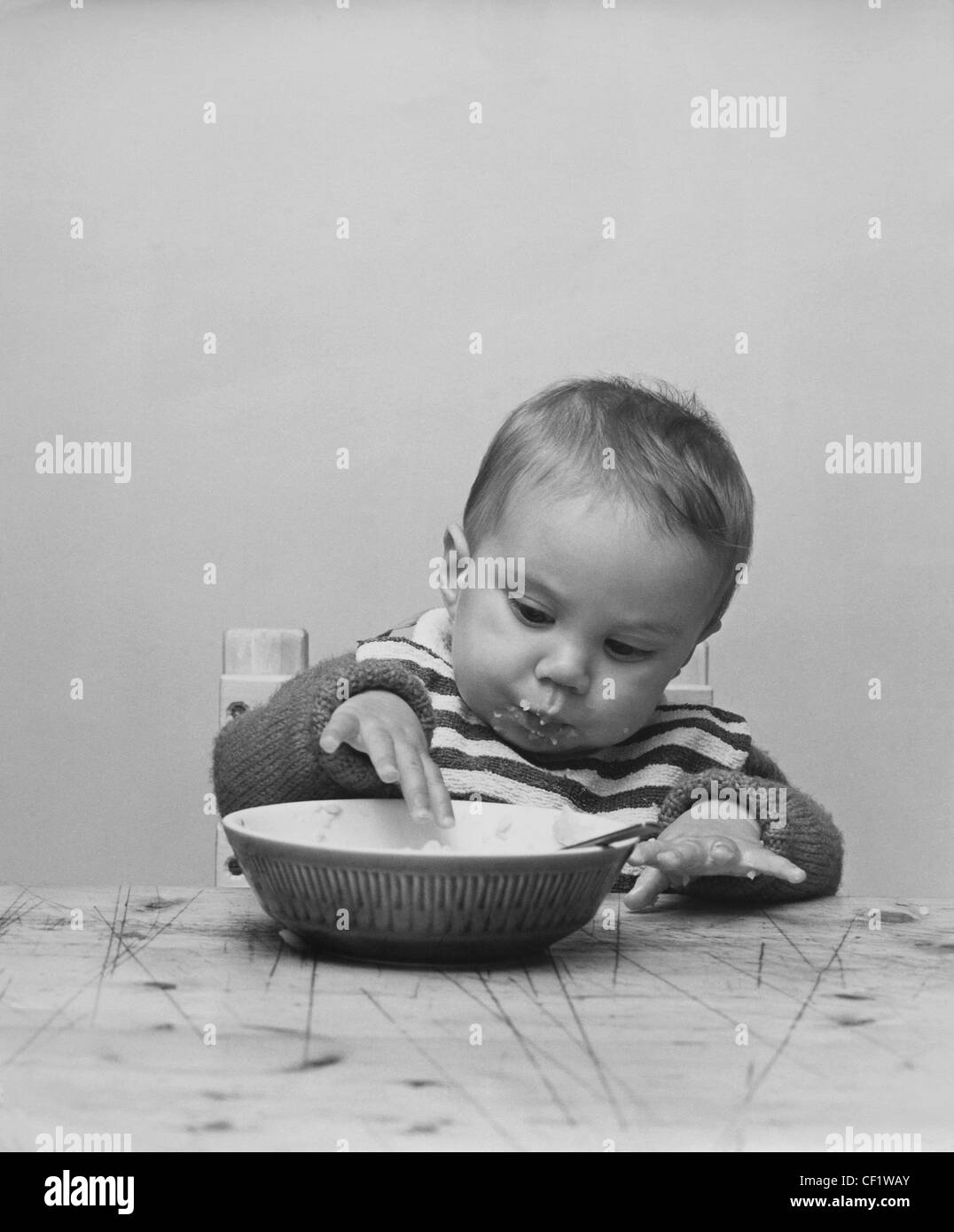 Child eating with hands Black and White Stock Photos & Images - Alamy