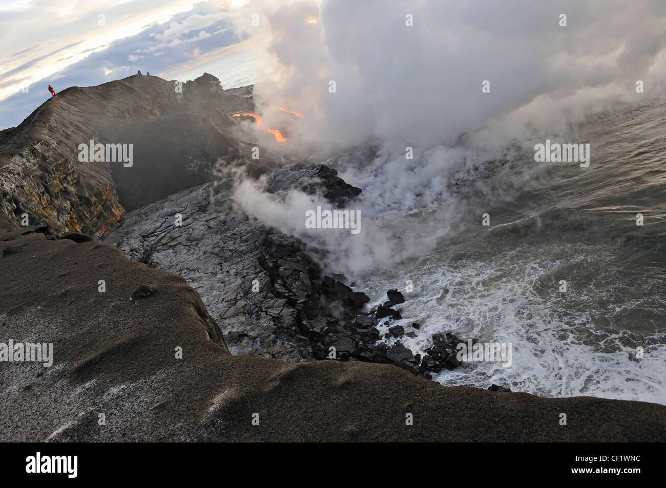 Steam rising off lava flowing into ocean, Kilauea Volcano, Big Island ...