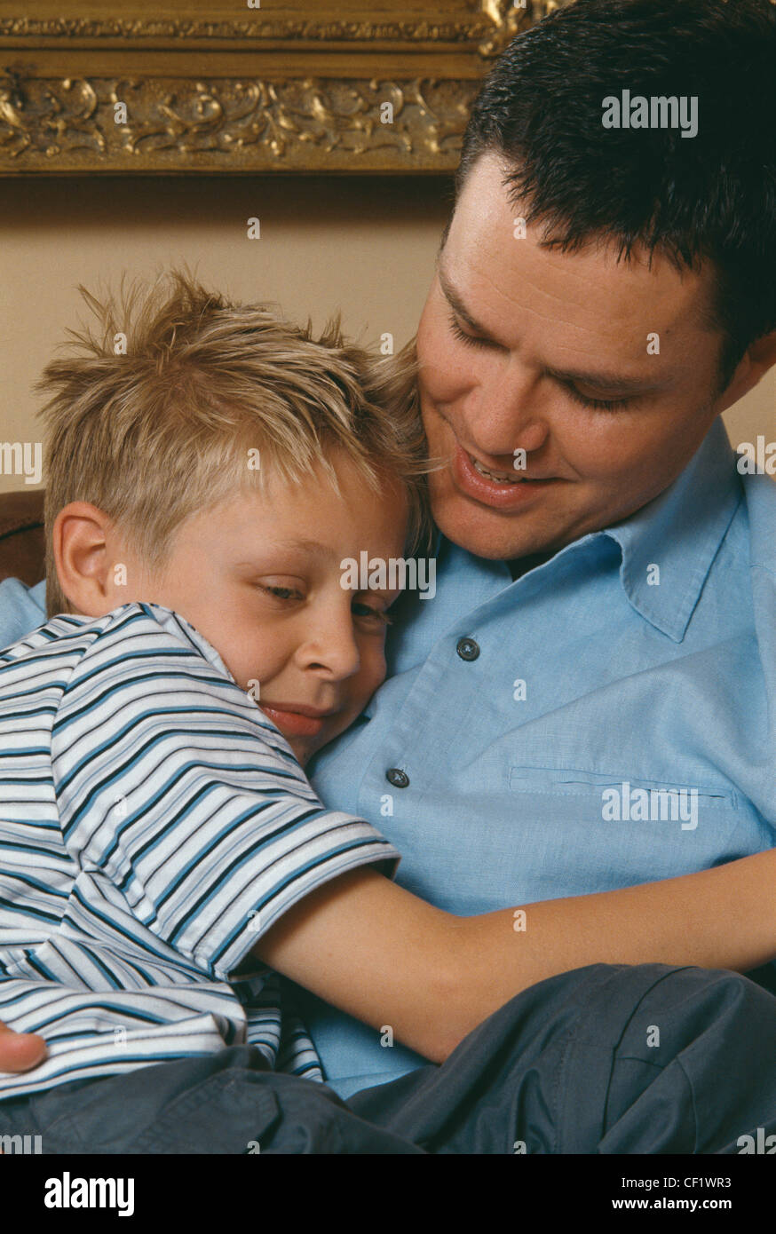 Father short brown hair wearing short sleeved blue shirt male child ...