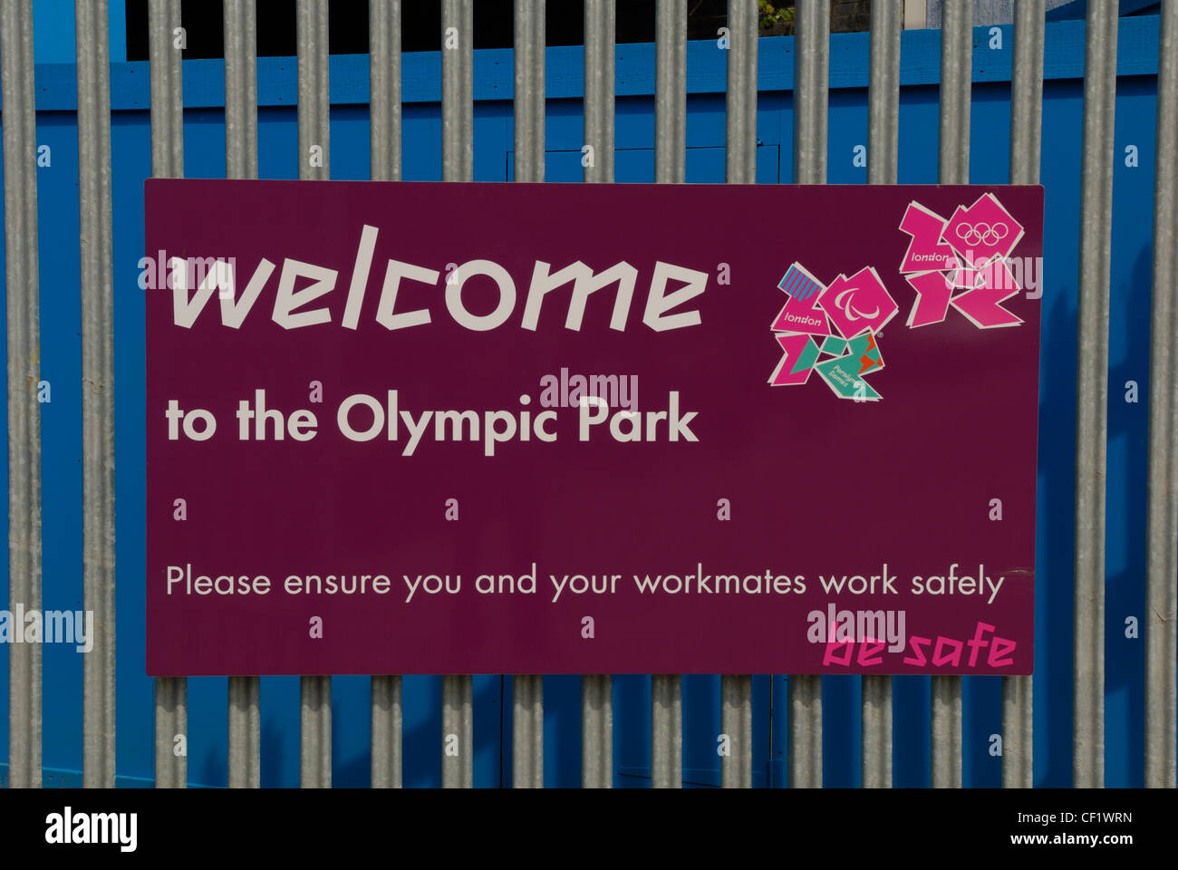 A Welcome notice on a gate at the entrance to the Olympic Park ...