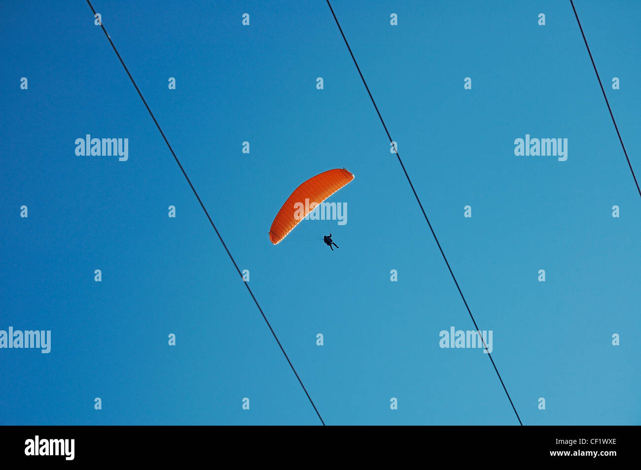 paraglider between telegraph lines oludeniz turkey Stock Photo - Alamy