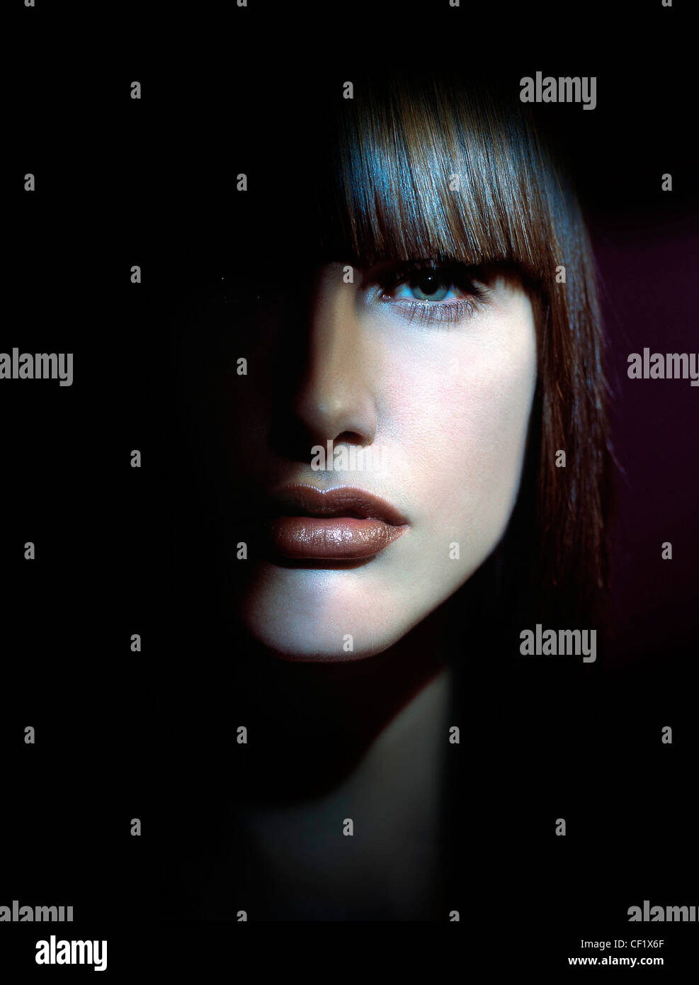 Female brunette hair framing face straight fringe wearing mascara and ...