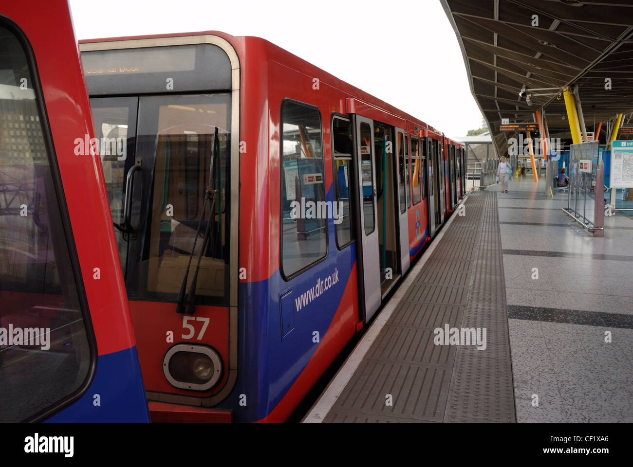 A Docklands Light Railway train by a platform at Stratford station. The ...