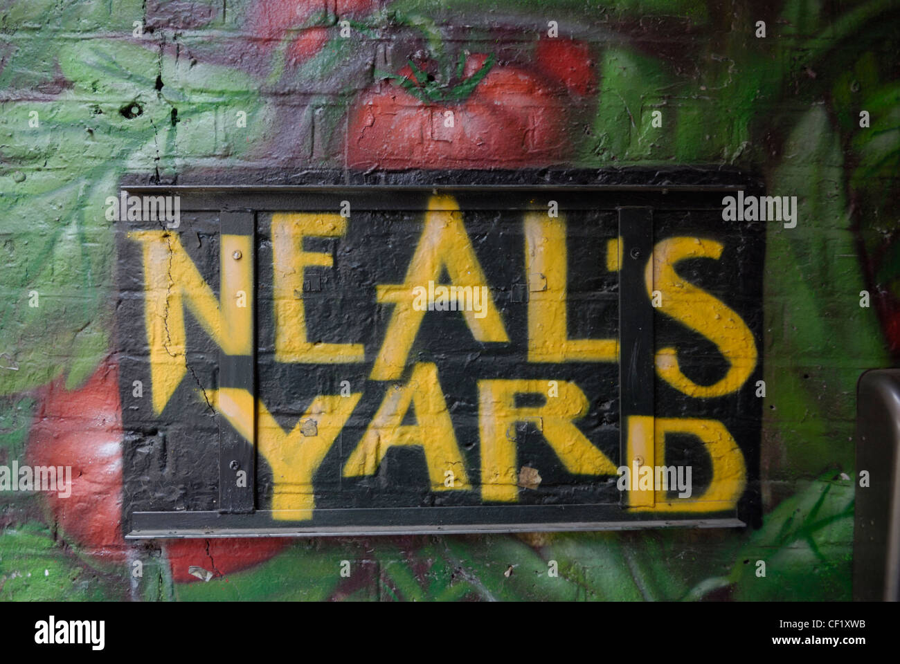 A sign painted on the wall of an alleyway leading to Neal's Yard in ...