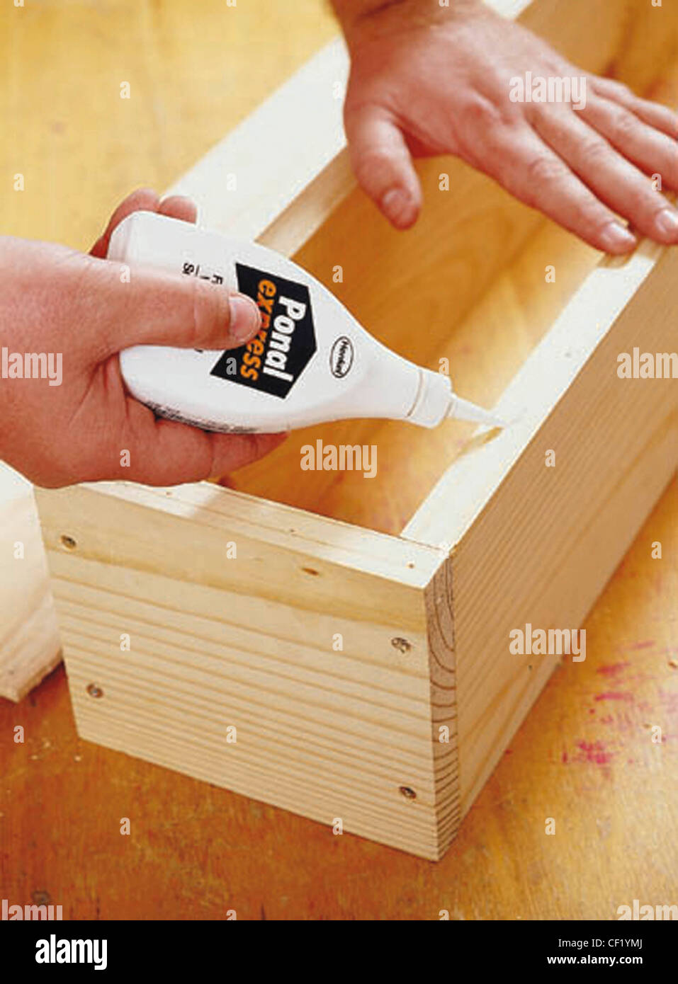 Easy Living TO MAKE STEP BY STEP: Anonymous male applying glue to sides ...