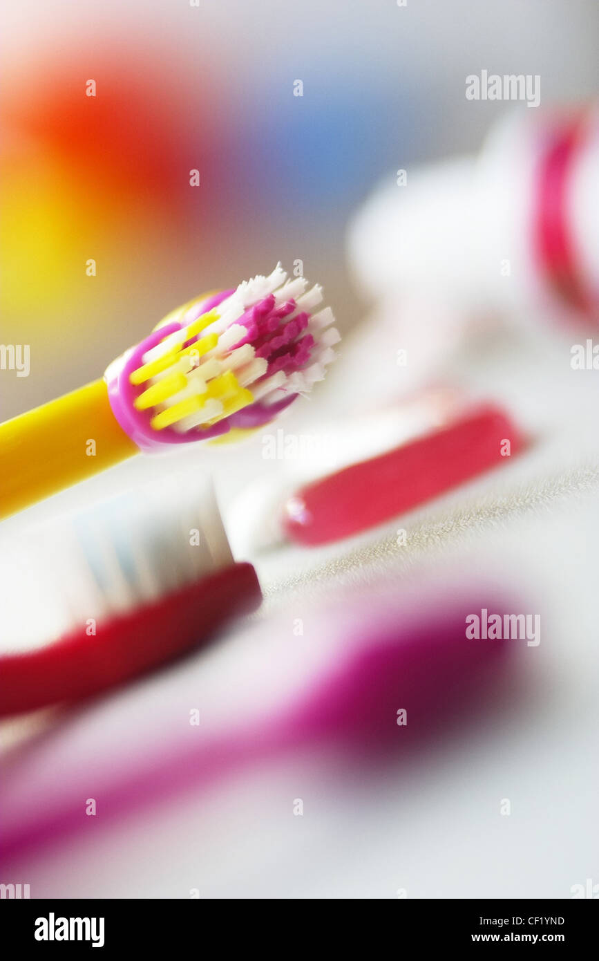 Pink and yellow childs electric toothbrush, adults red and pink ...