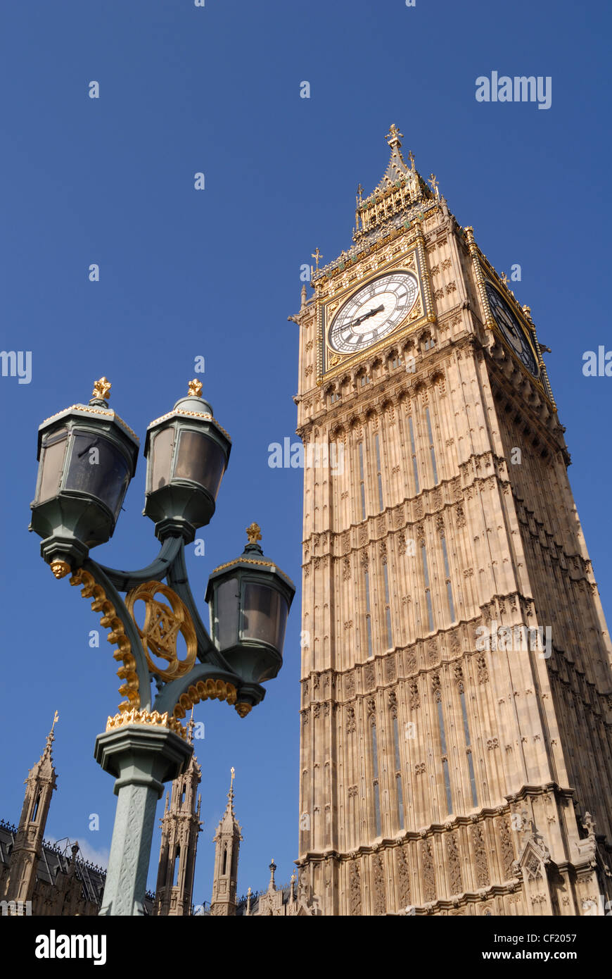 Looking up at Big Ben in the early morning sun. Big Ben is actually the ...