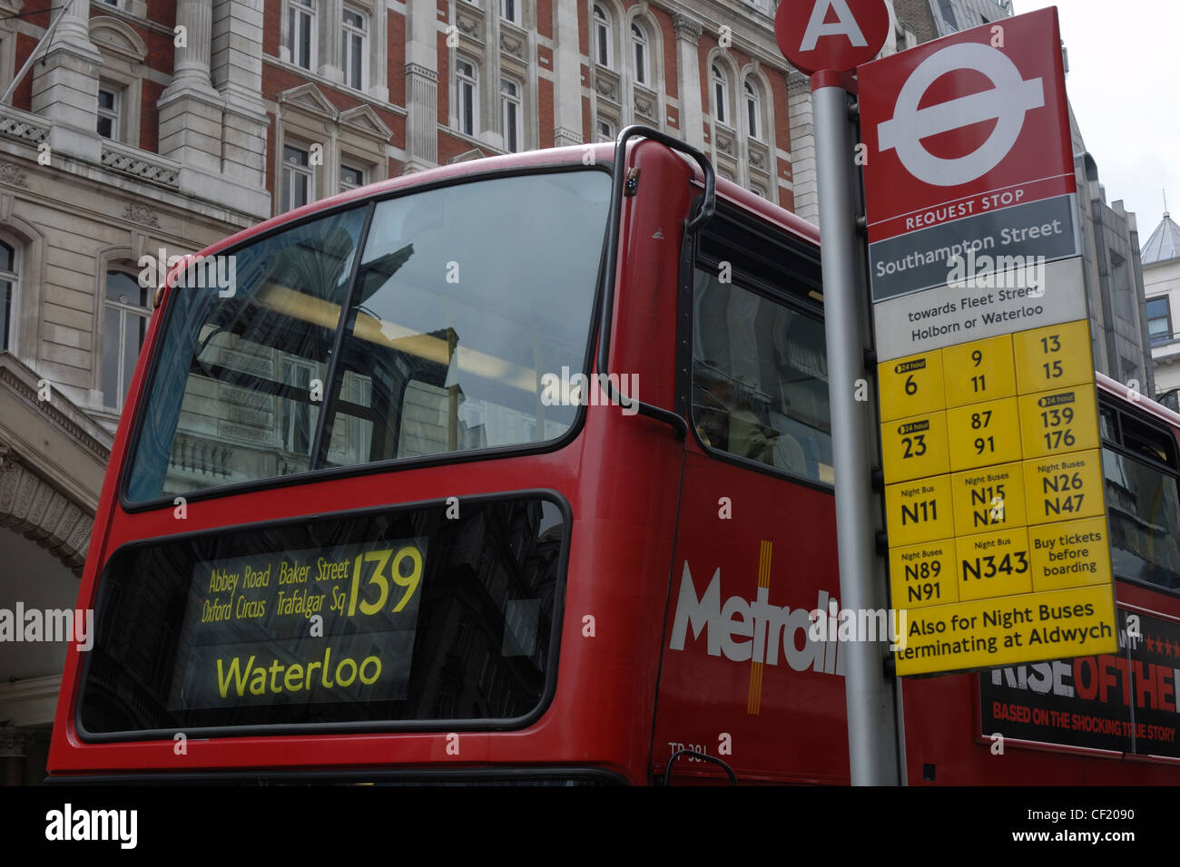 A bus stop and double decker bus on the Strand. Yellow squares on the ...