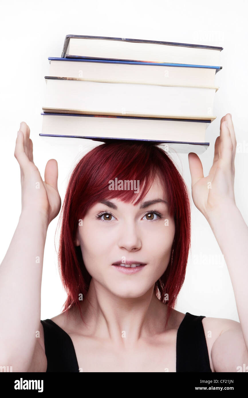 woman with books on top of her head Stock Photo - Alamy