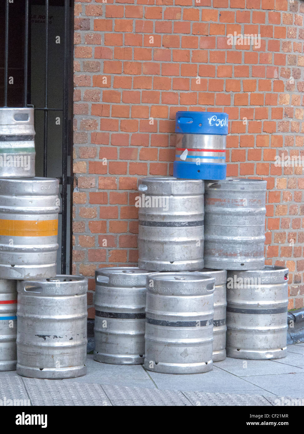beer kegs against the red brick wall of a public house in victoria ...