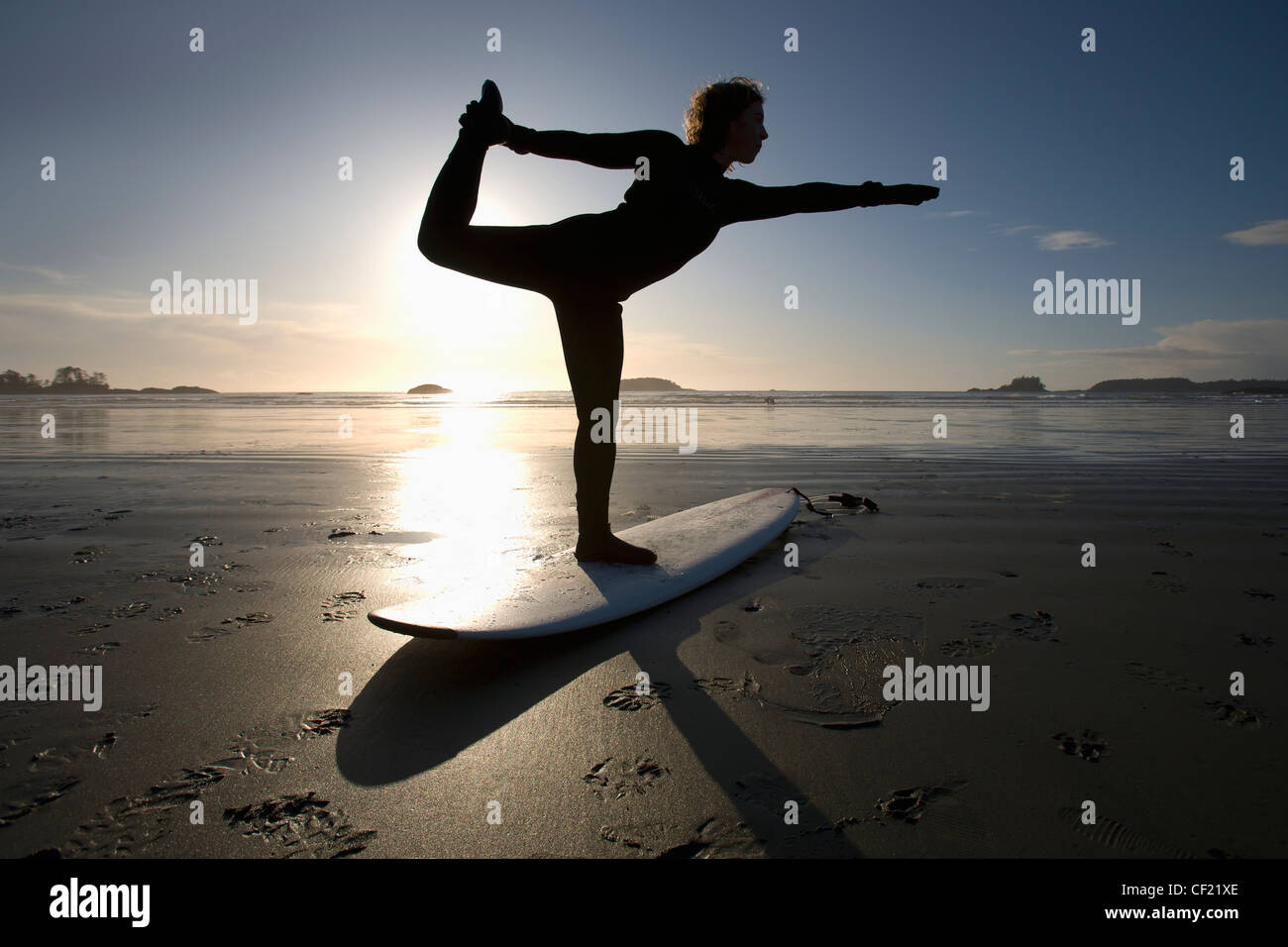 Silhouette Of Female Surfer Doing Bow Pulling Yoga Pose; Chesterman ...