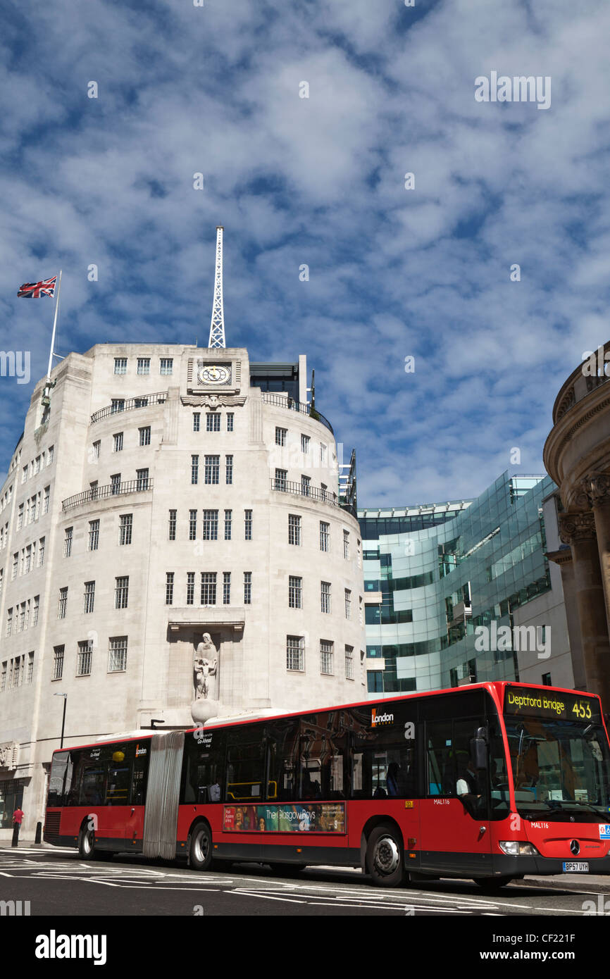 An articulated bus (bendy bus) passing Broadcasting House, the BBC's ...