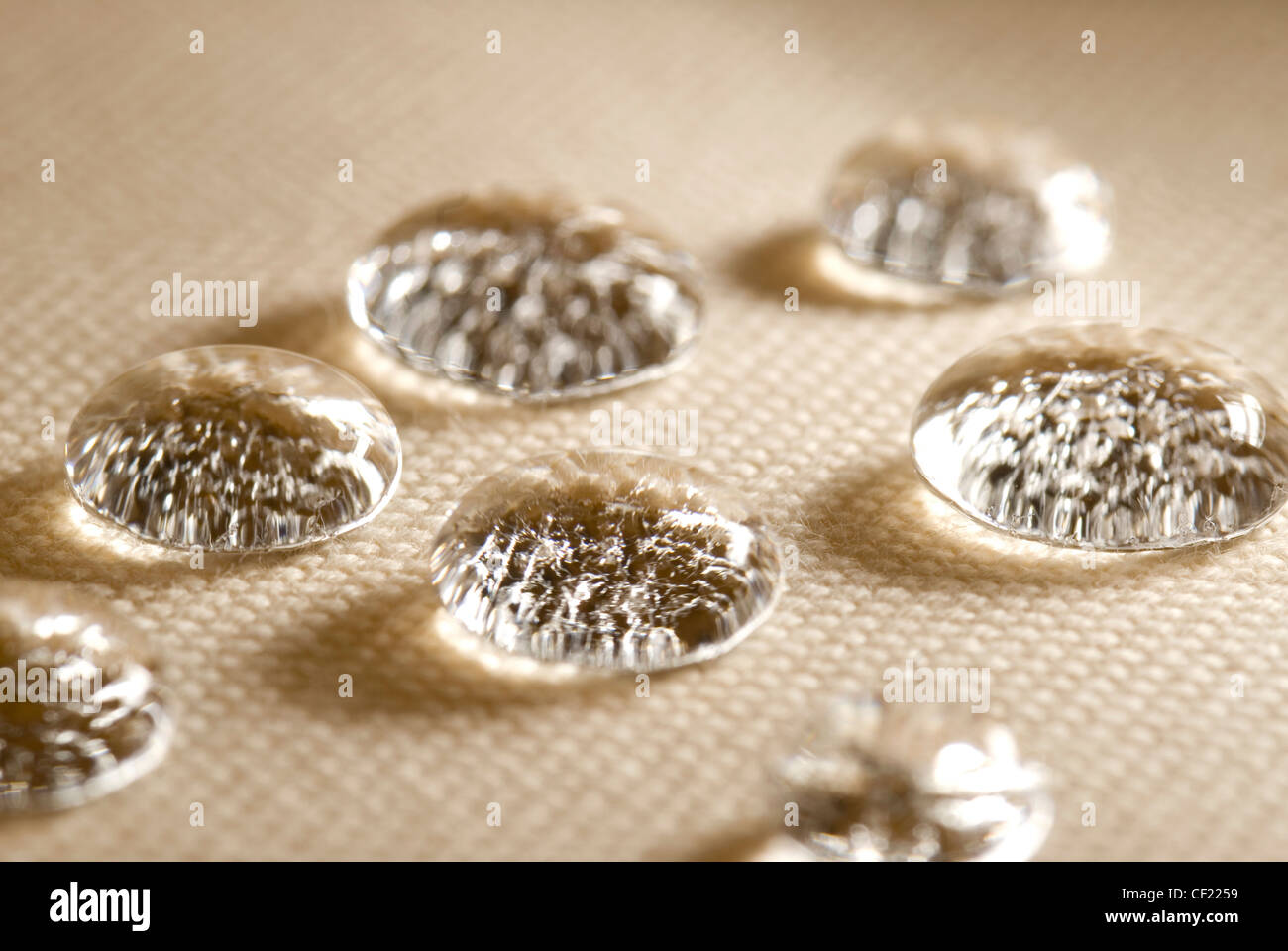 Water drops on canvas still life Stock Photo - Alamy