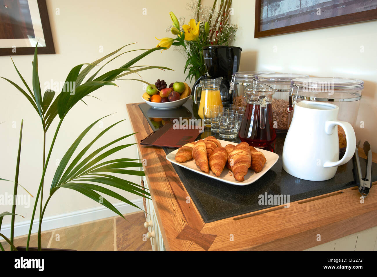 A small breakfast bar, set for bed and breakfast customers, with ...