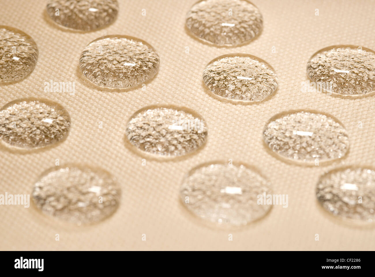 Water drops on canvas still life Stock Photo - Alamy