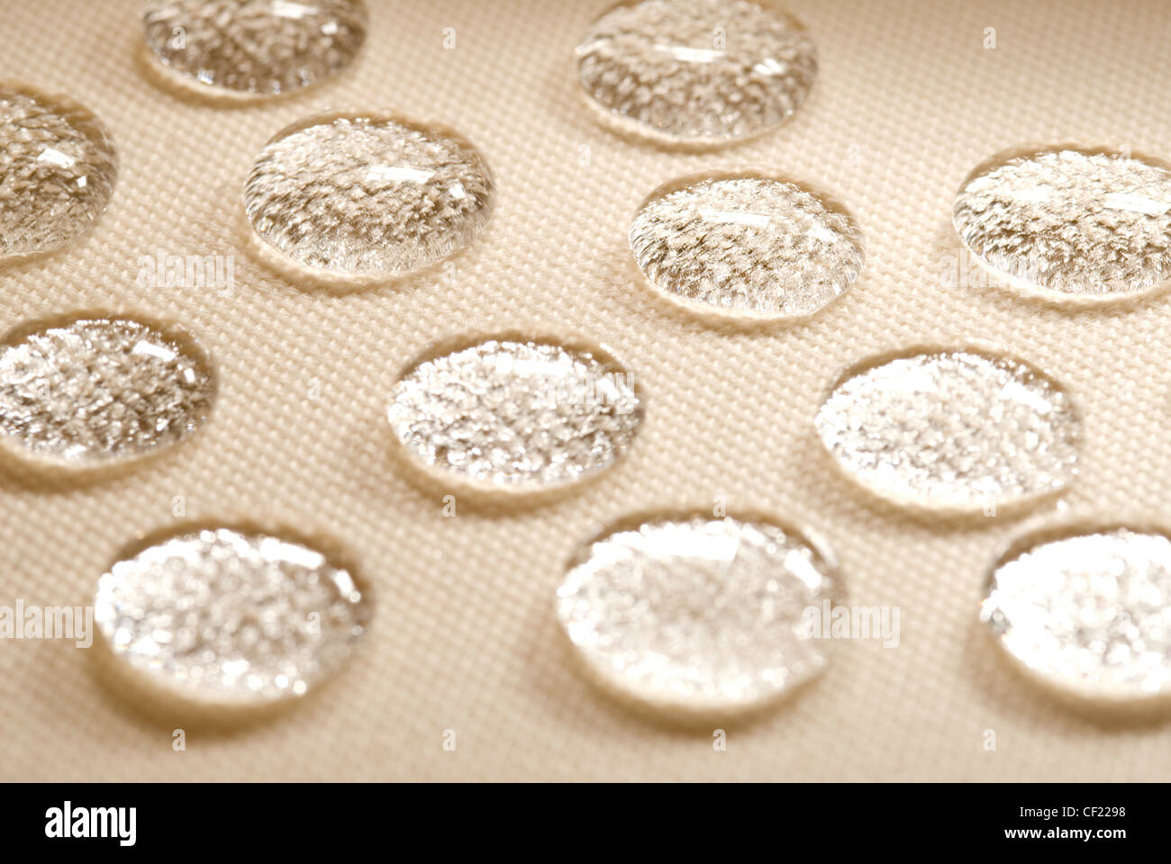 Water drops on canvas still life Stock Photo - Alamy