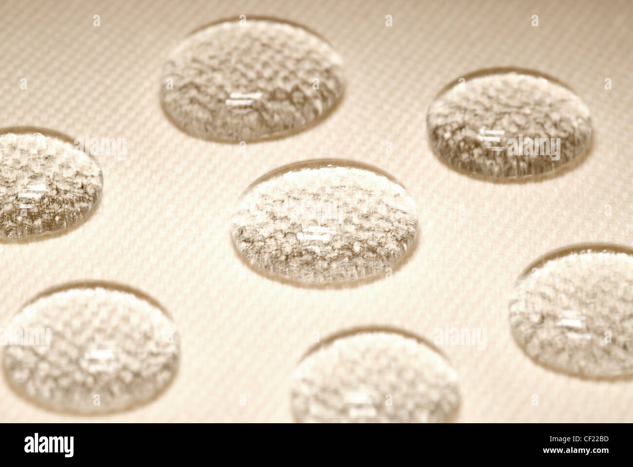 Water drops on canvas still life Stock Photo - Alamy