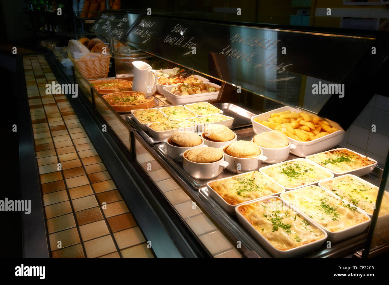 Hot food servery showing a range of pies and vegetables Stock Photo - Alamy