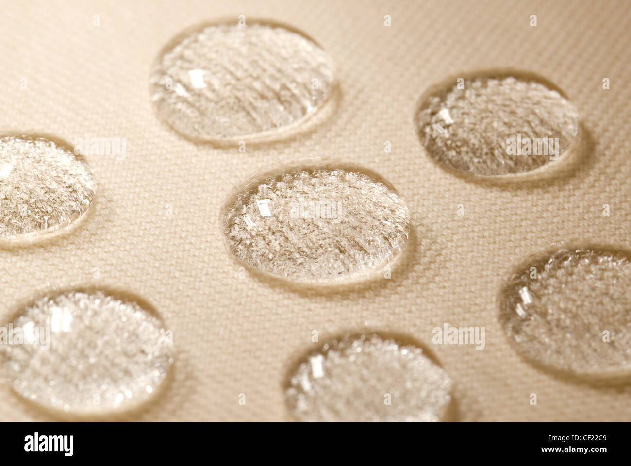 Water drops on canvas still life Stock Photo - Alamy