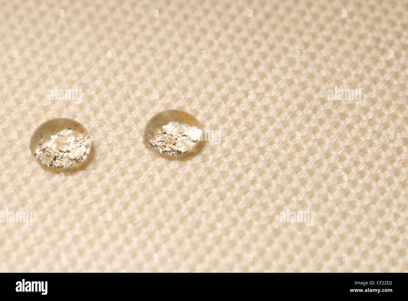 Water drops on canvas still life Stock Photo - Alamy