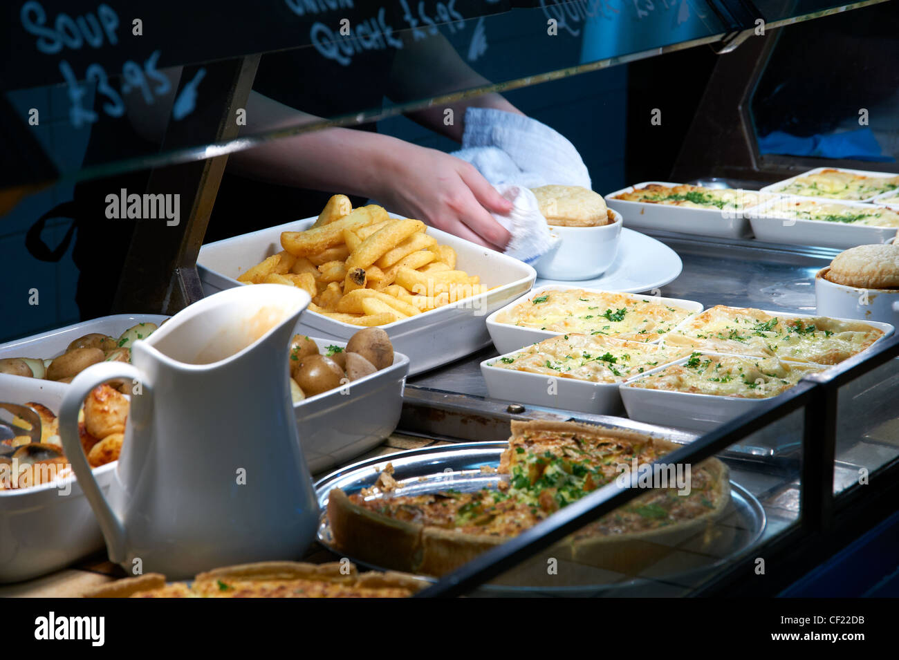 Hot food servery showing a range of pies and vegetables Stock Photo - Alamy