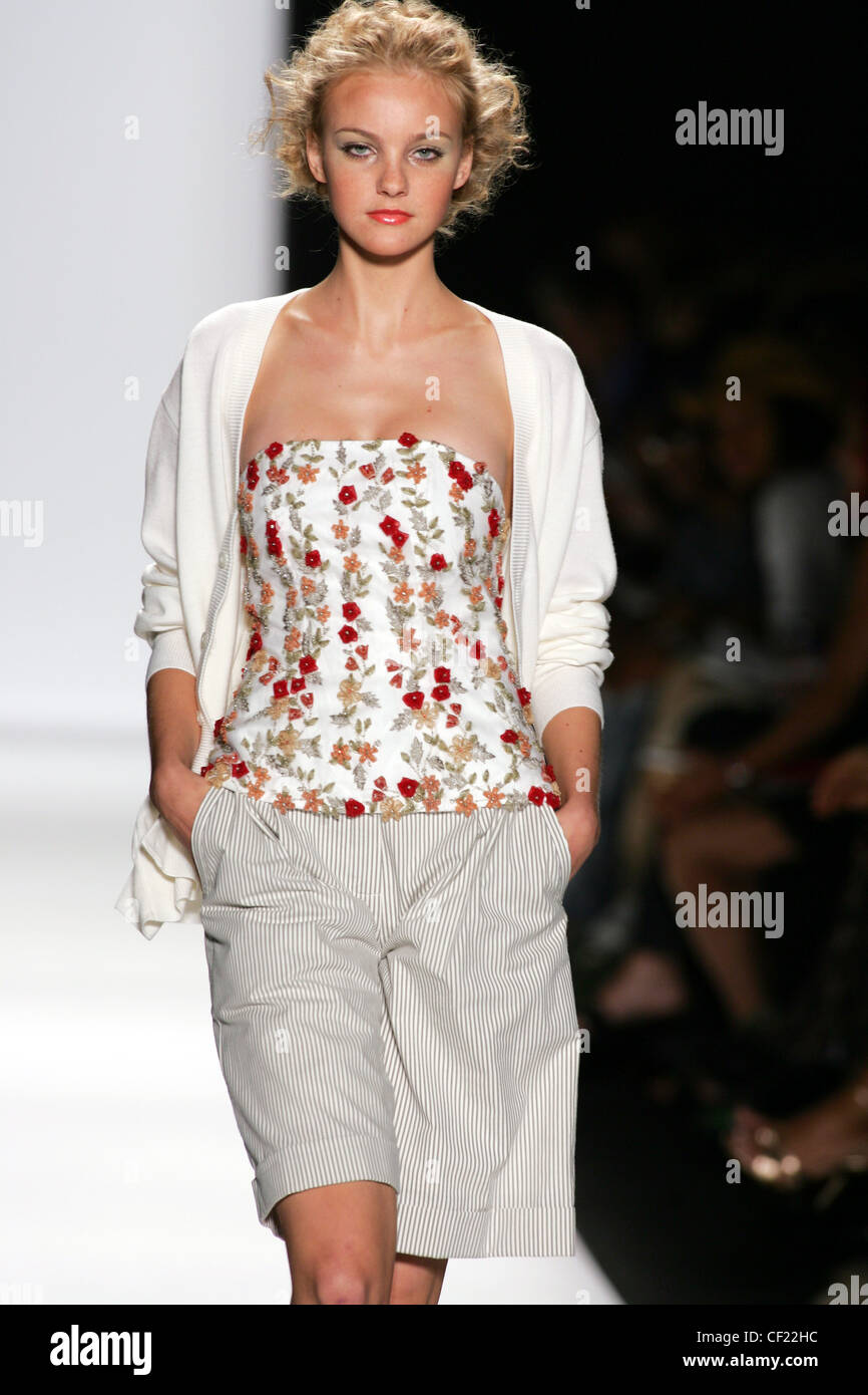 Model Caroline Trentini curly blonde hair wearing strapless white top ...