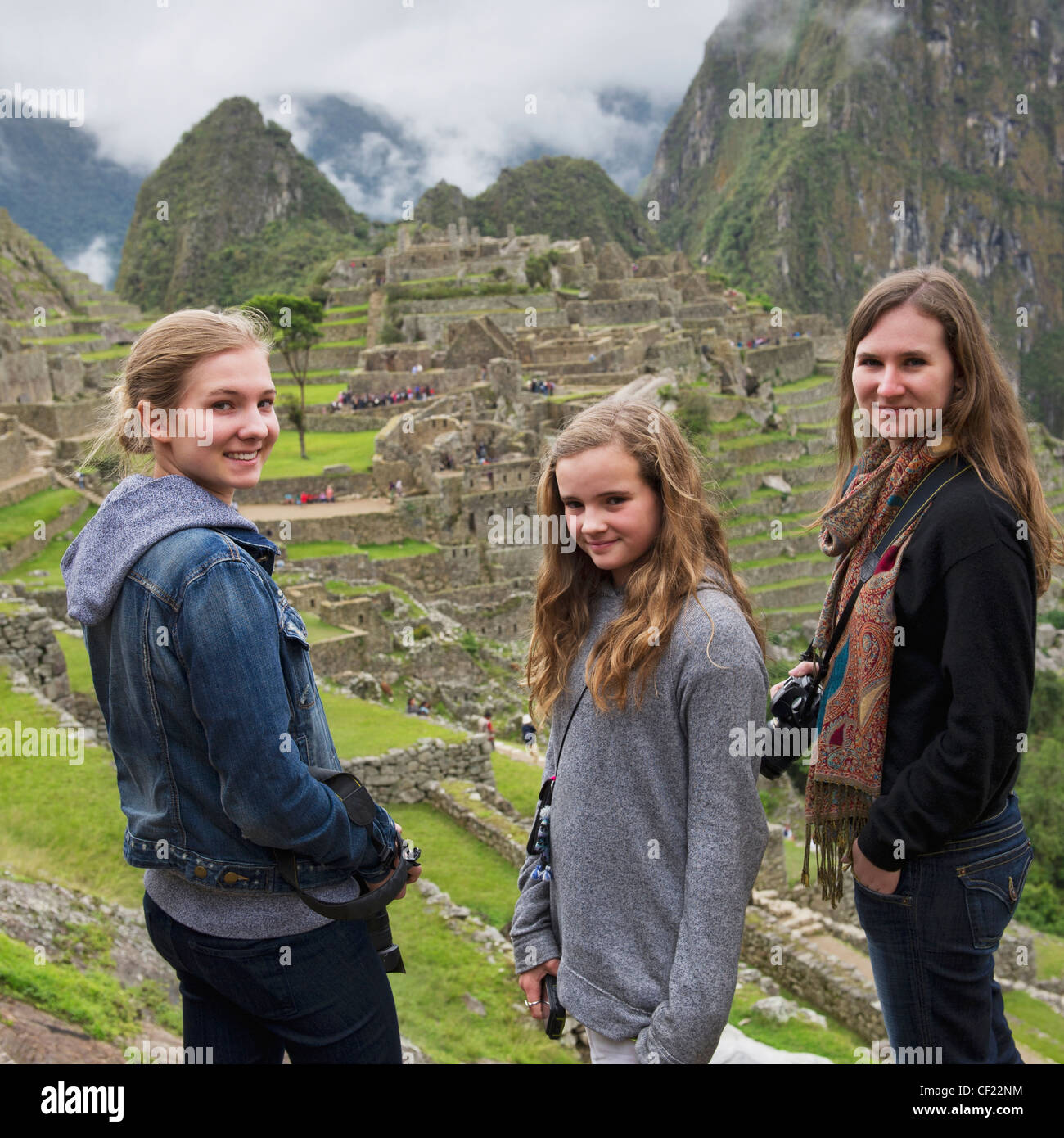 Three Girls Touring Machu Picchu; Peru Stock Photo - Alamy