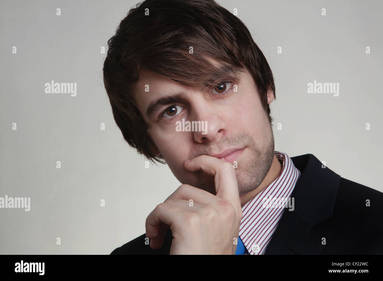 business man thinking looks deep in thought Stock Photo - Alamy