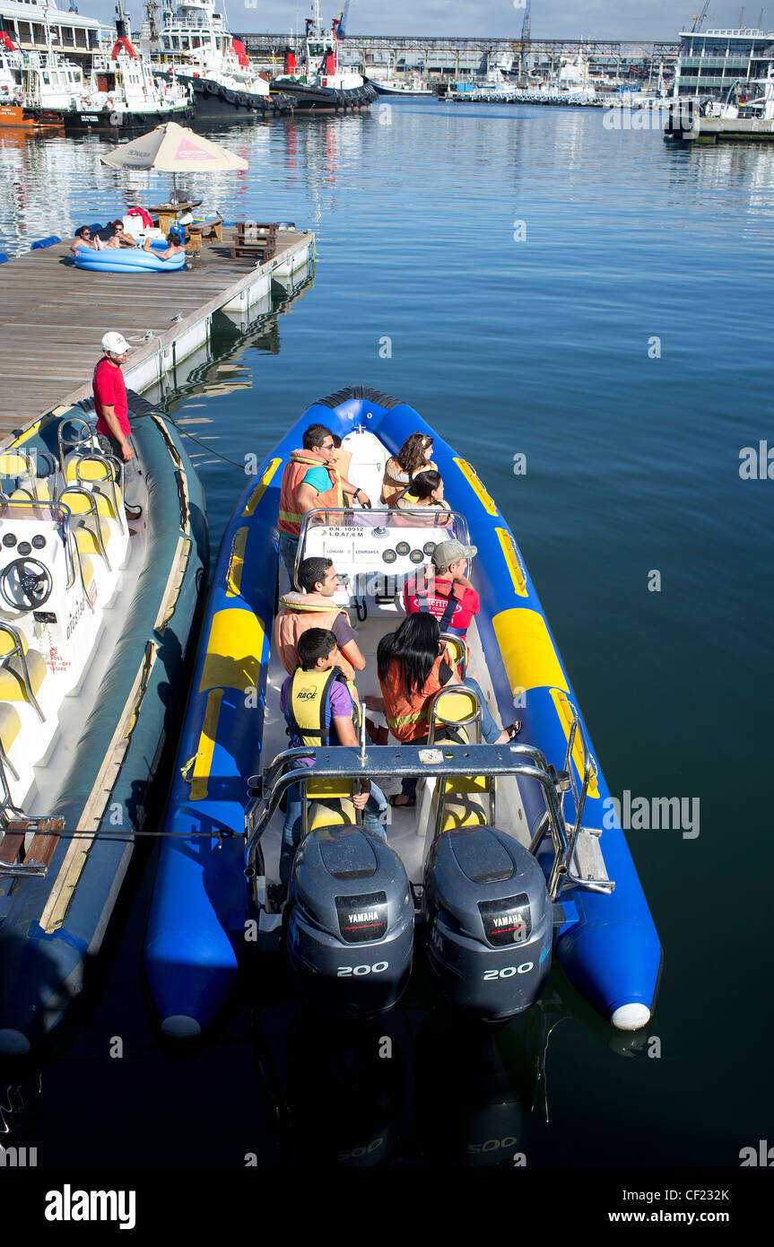 The V&A Waterfront Cape Town South Africa tourists aboard a high speed ...