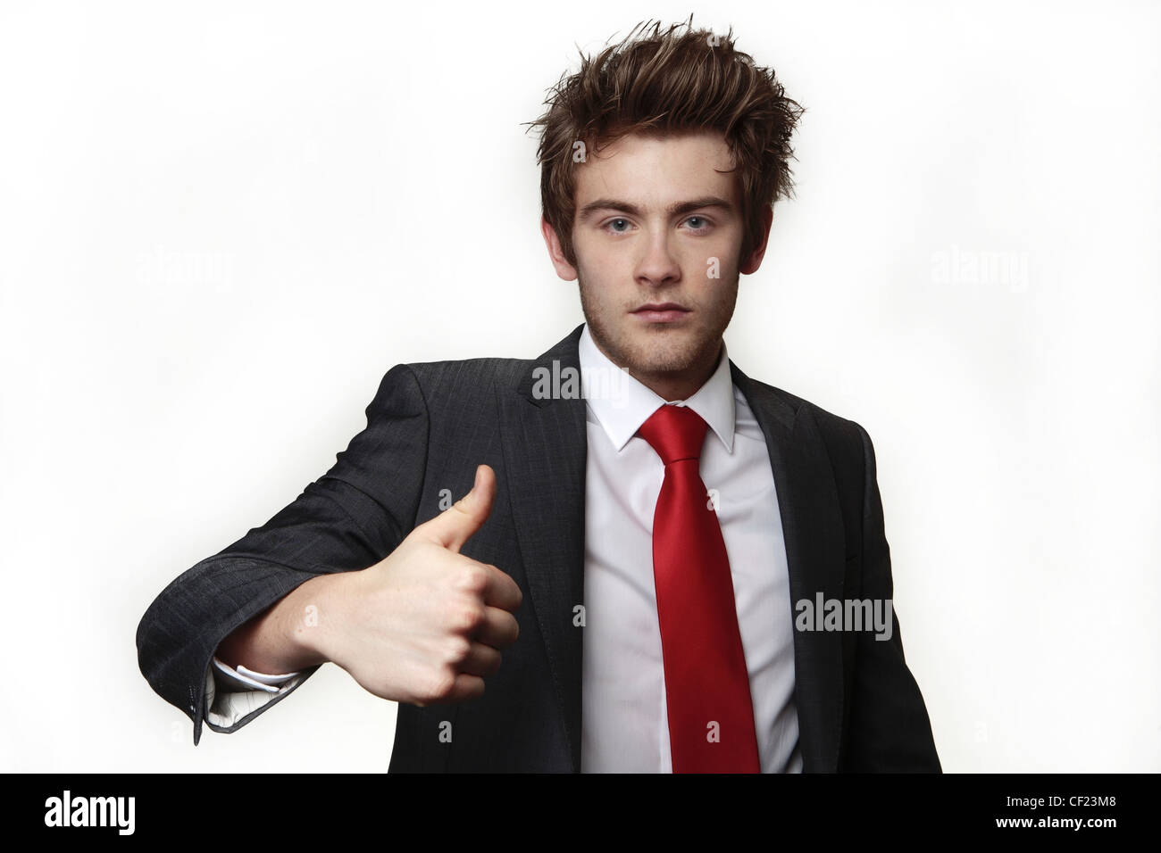 young businessman very happy with his thumbs up Stock Photo - Alamy