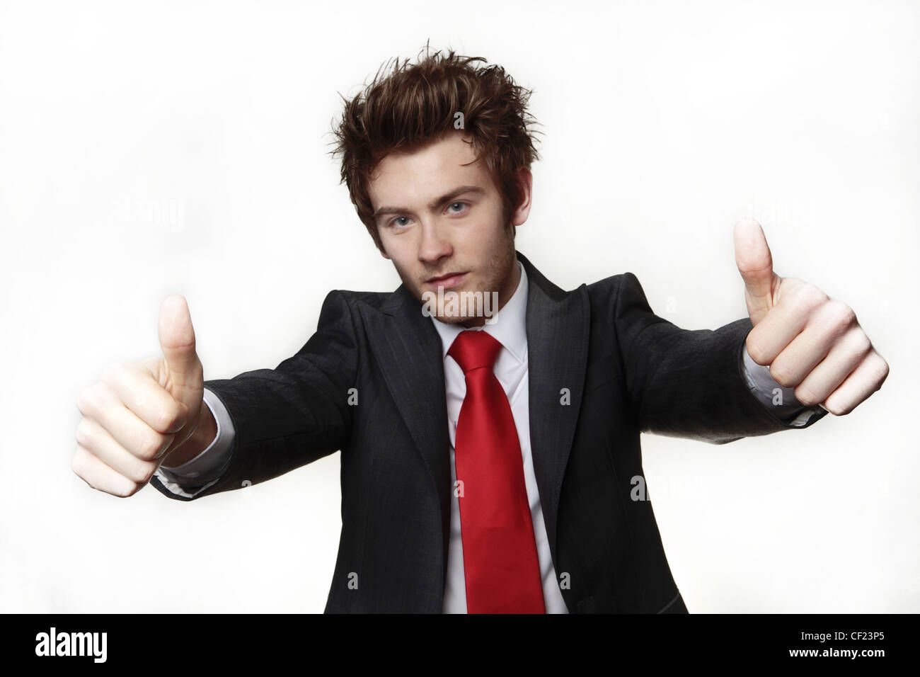 young businessman very happy with his thumbs up Stock Photo - Alamy